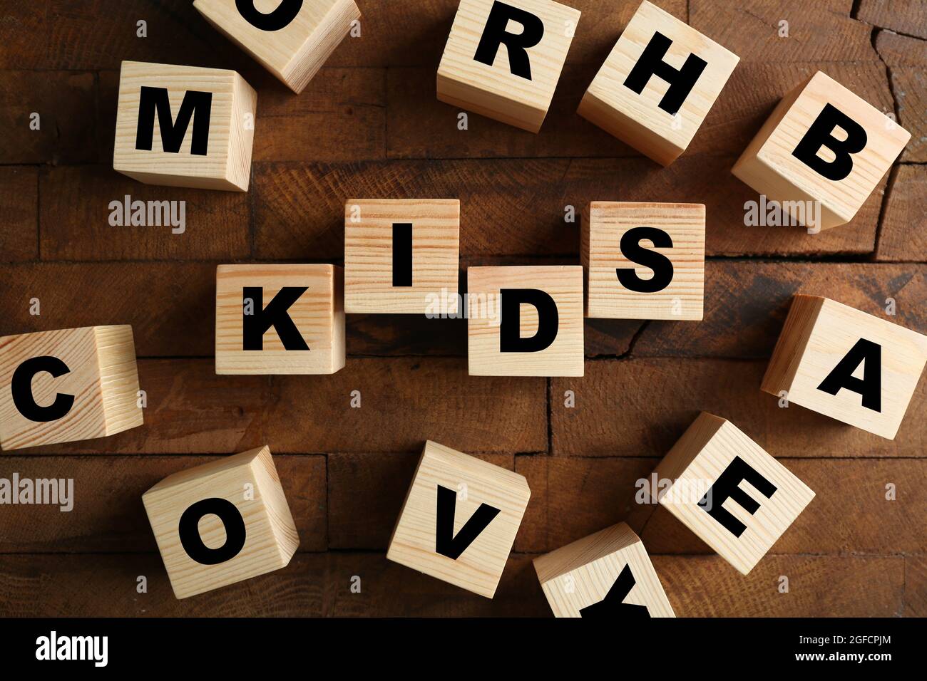 Word KIDS on wooden background Stock Photo - Alamy