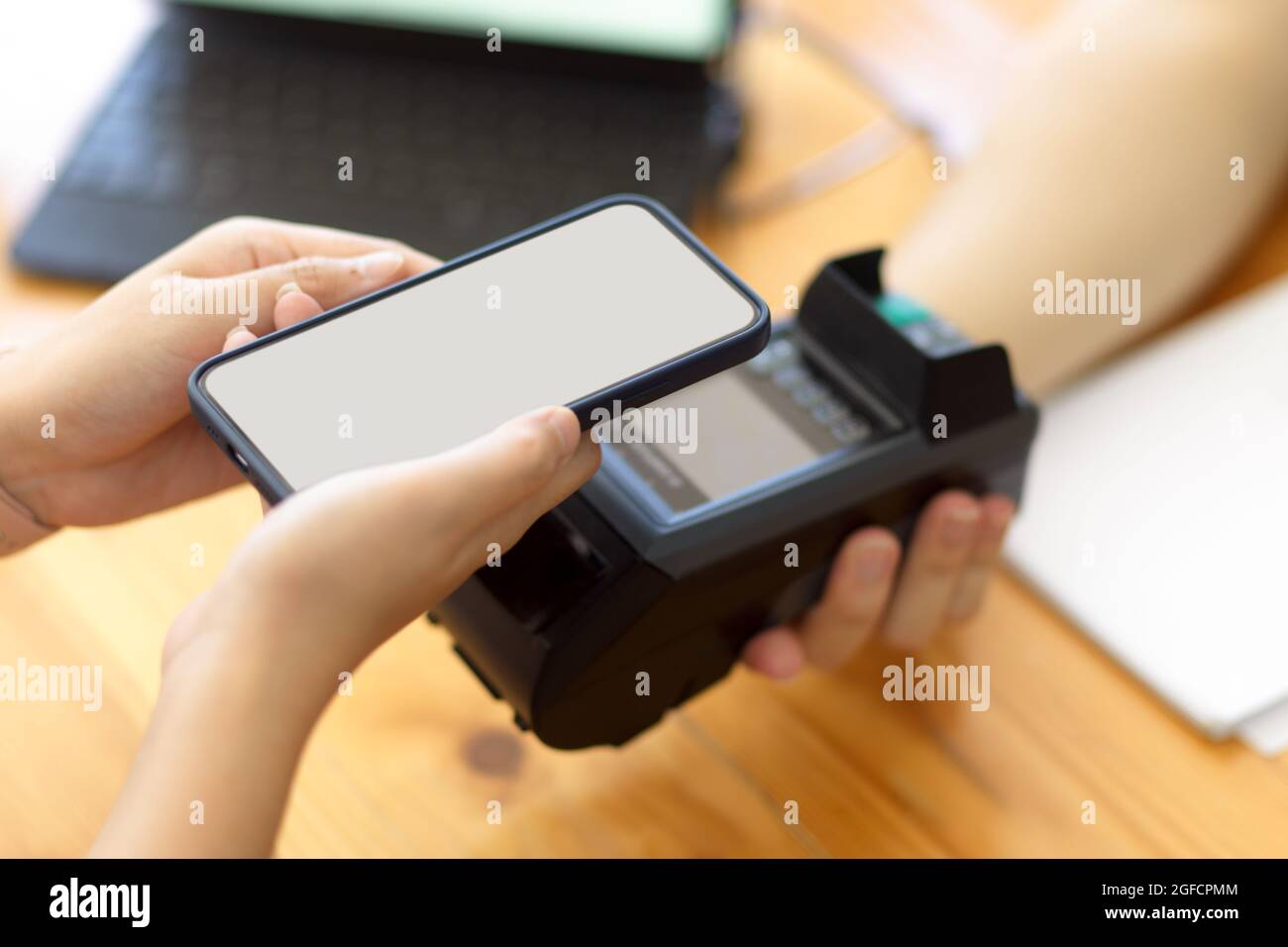 Customer scanning code to pay on payment terminal, cashless society ...