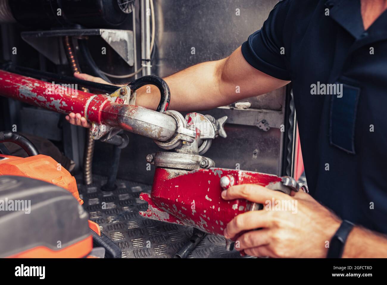 Firefighter holding fire hydrant for emergency firefighting. Concept of ...