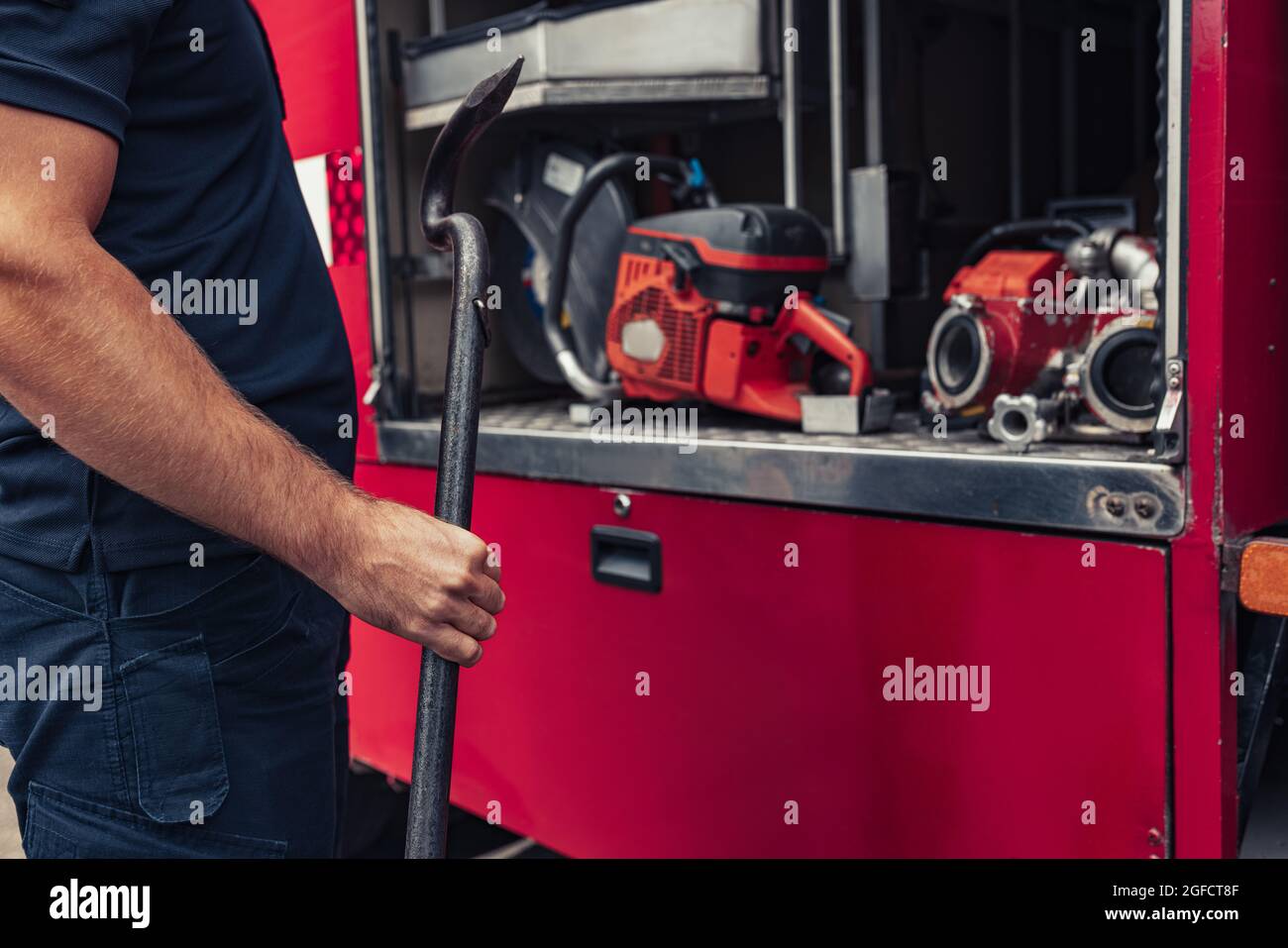 Firefighter holding special instrument for emergency firefighting Stock ...