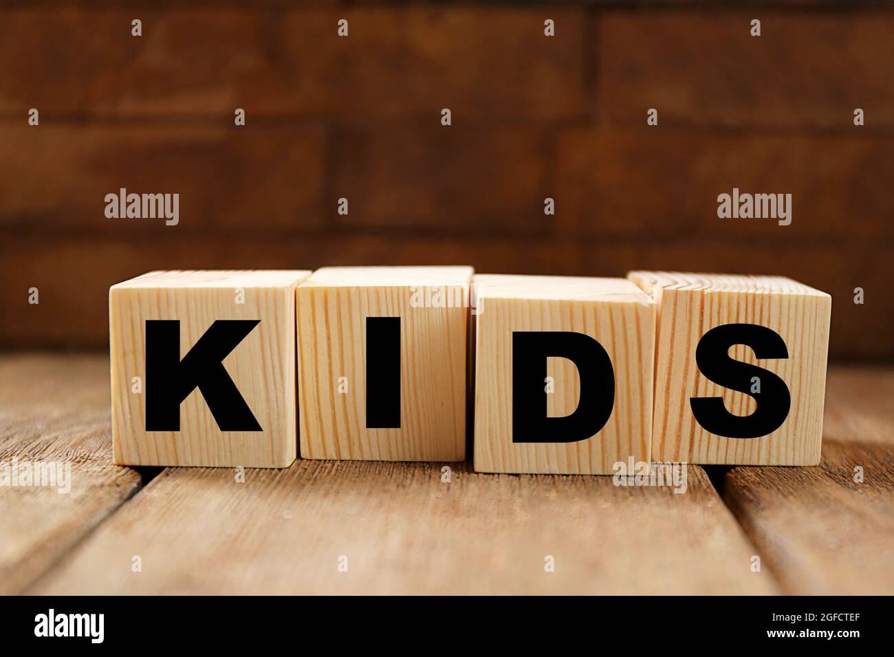 Word KIDS on wooden background Stock Photo - Alamy
