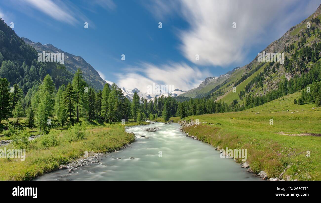 River flowing down from a glacier in the Swiss Alps Stock Photo - Alamy