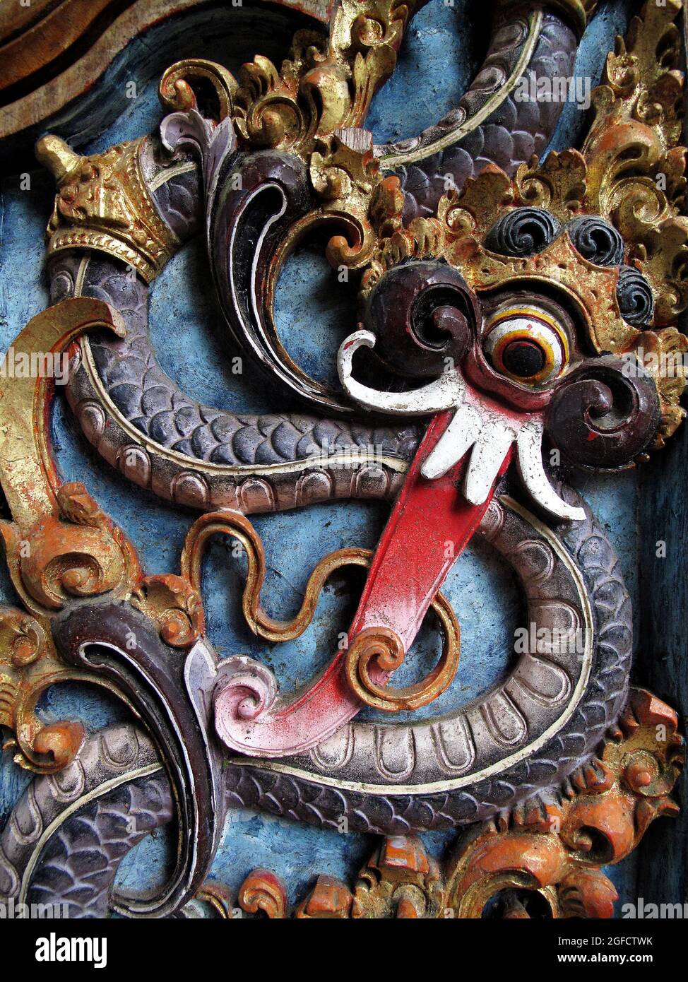 Antique traditional wood carved pattern with a colorful paint on a ...