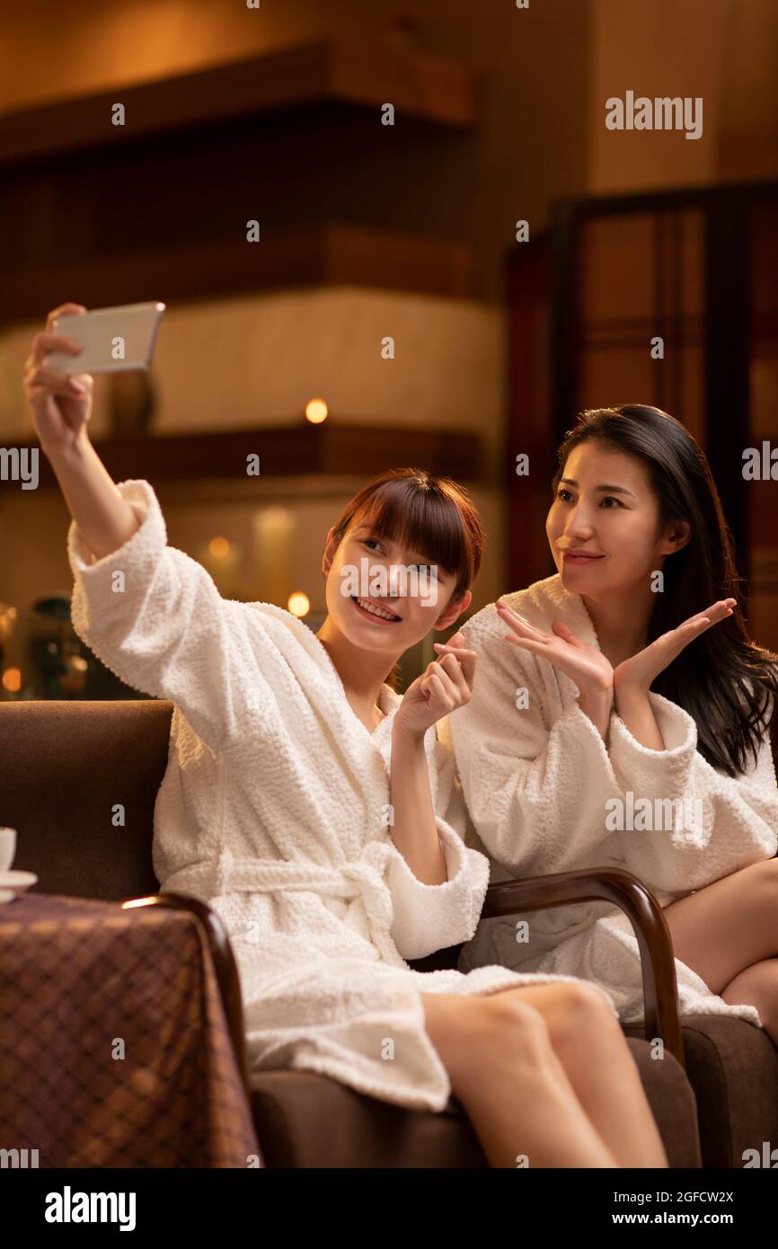 Beautiful young women relaxing in spa center Stock Photo - Alamy