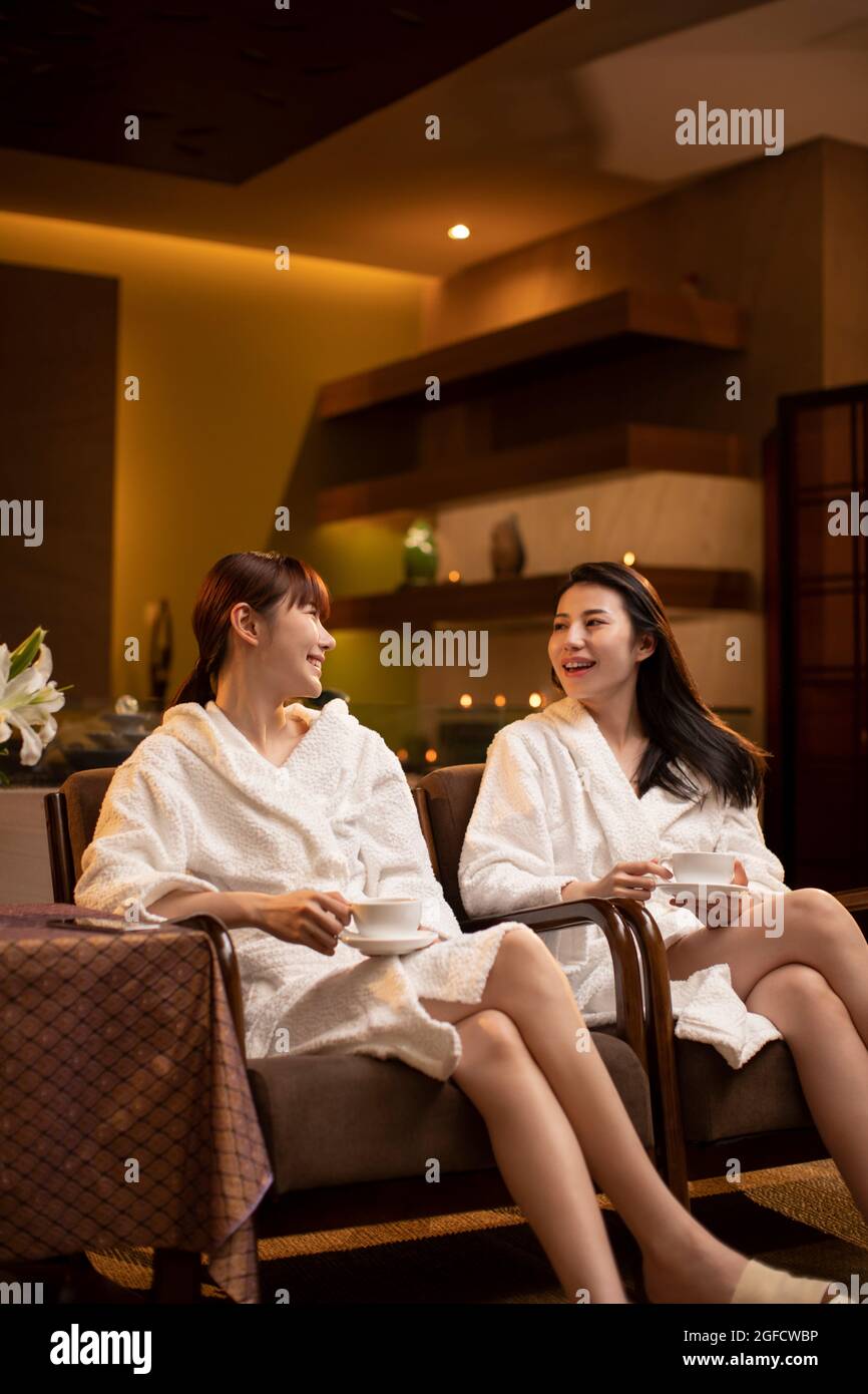 Beautiful young women talking in spa center Stock Photo - Alamy
