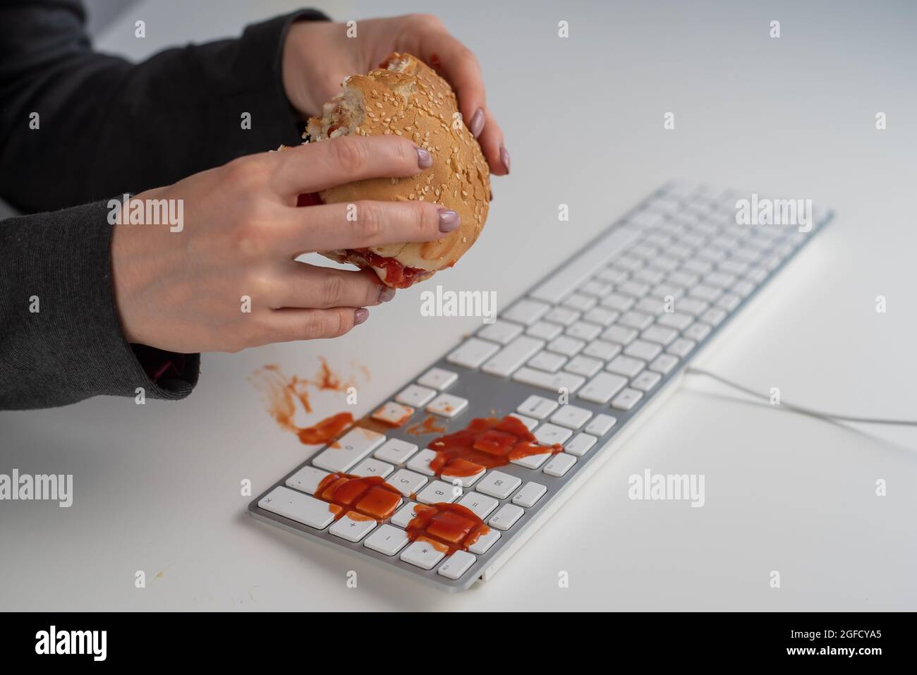 Businesswoman Eating Burger Desk High Resolution Stock Photography and ...