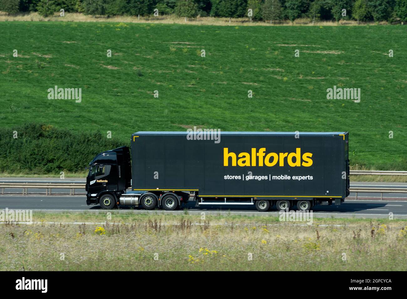 Halfords lorry on the M40 motorway, Warwickshire, England, UK Stock ...