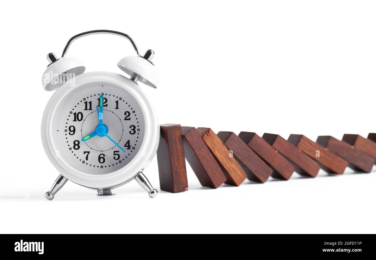 Alarm clock blocked dominoes row, isolated on white Stock Photo - Alamy