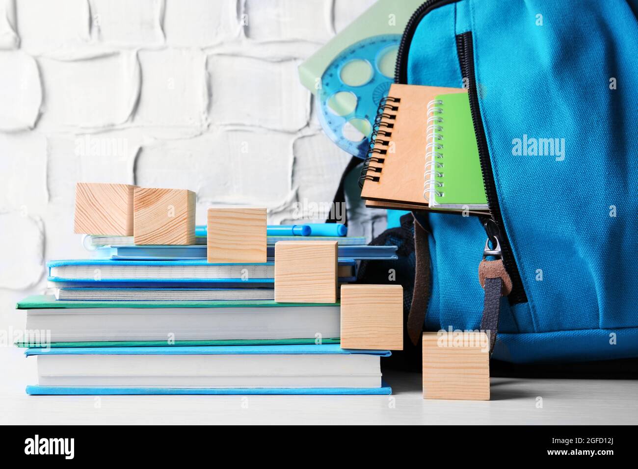 Wooden blocks with space for text and stationery on light background ...