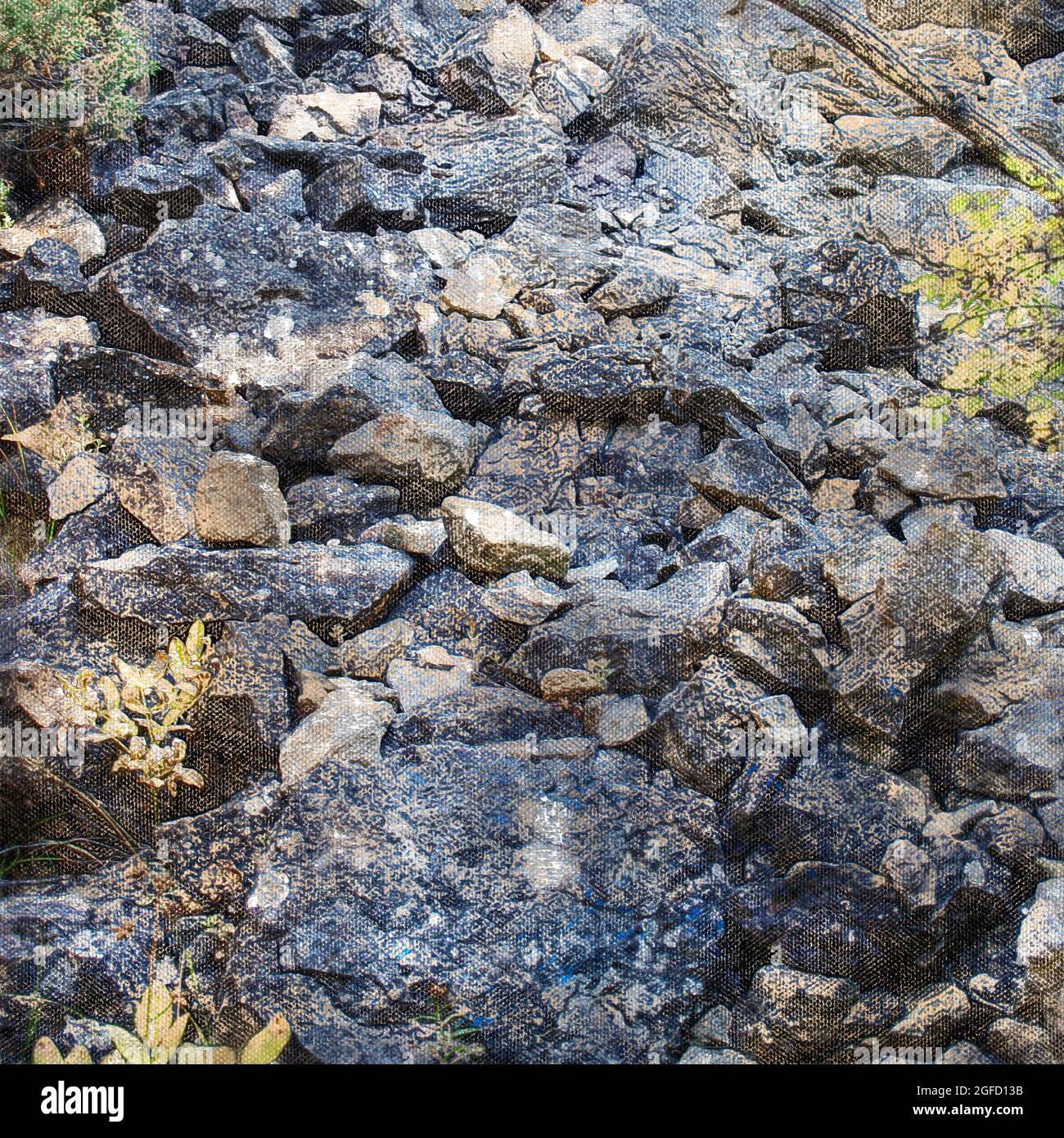 A rockfall in the mountains. Rocks of various sizes blocked a narrow ...