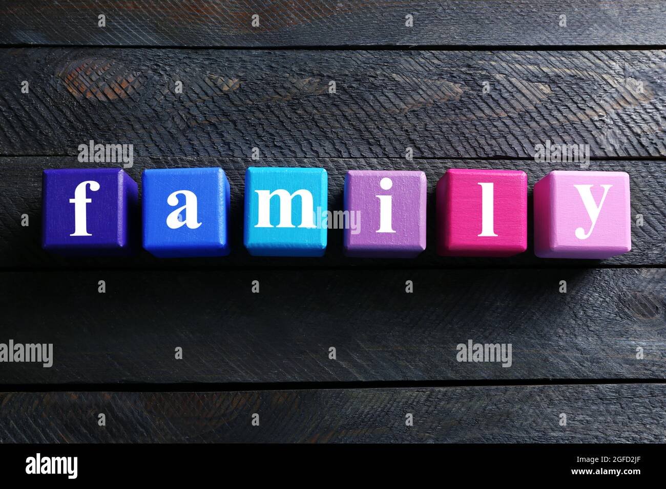 Color word FAMILY on wooden background Stock Photo - Alamy