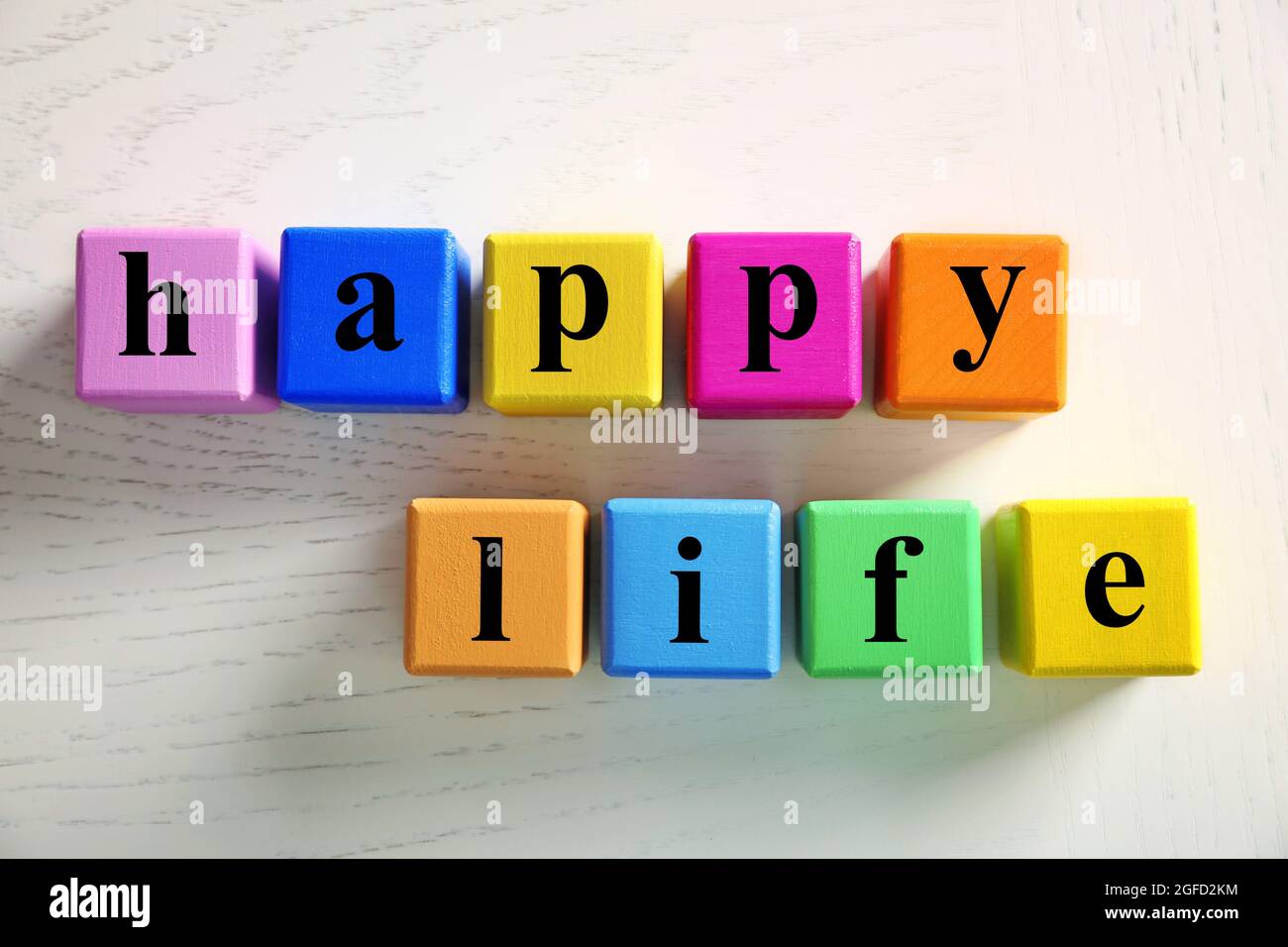 Color words HAPPY LIFE on light background Stock Photo - Alamy