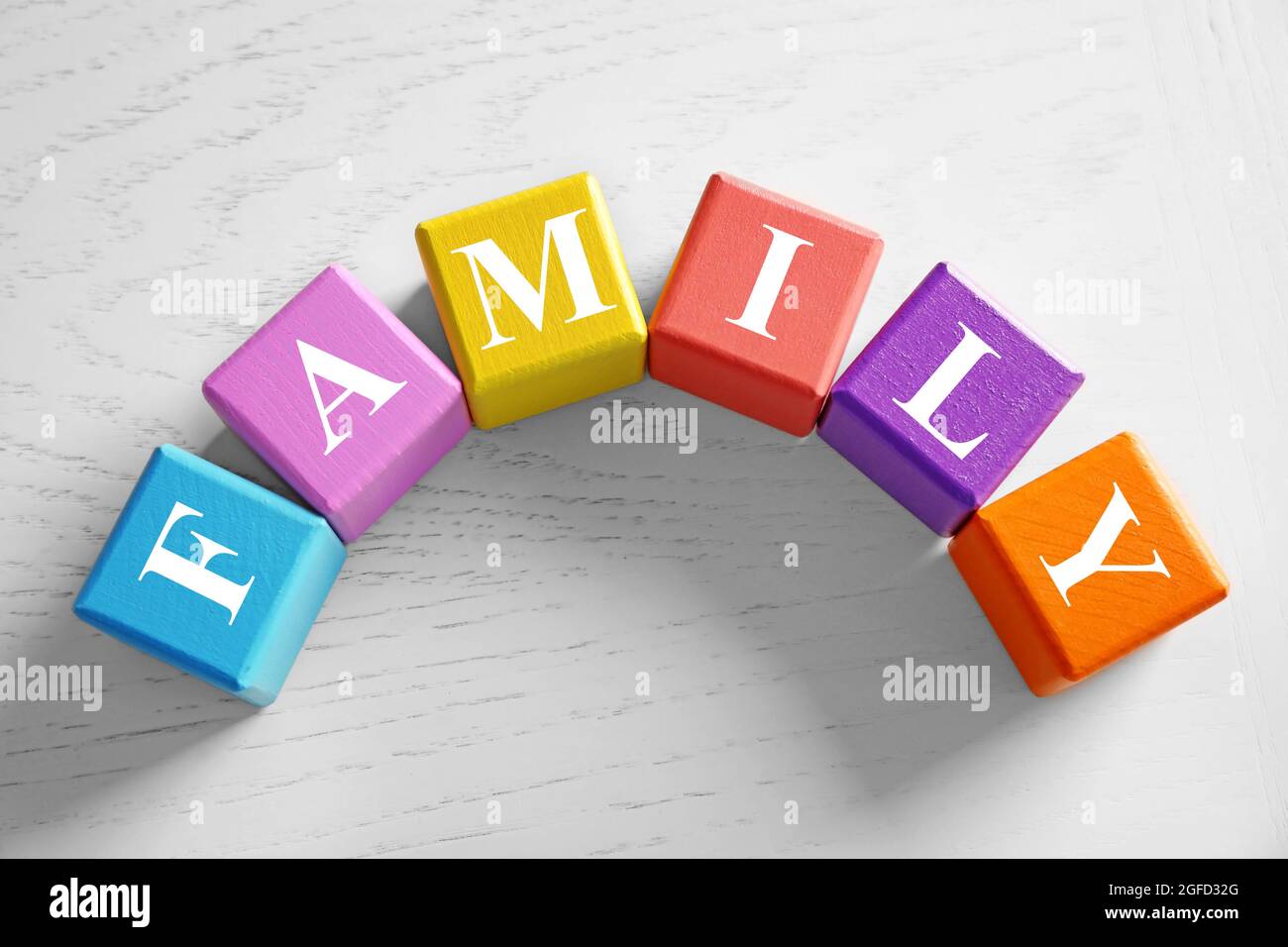 Colorful cubes with word FAMILY on wooden background Stock Photo - Alamy