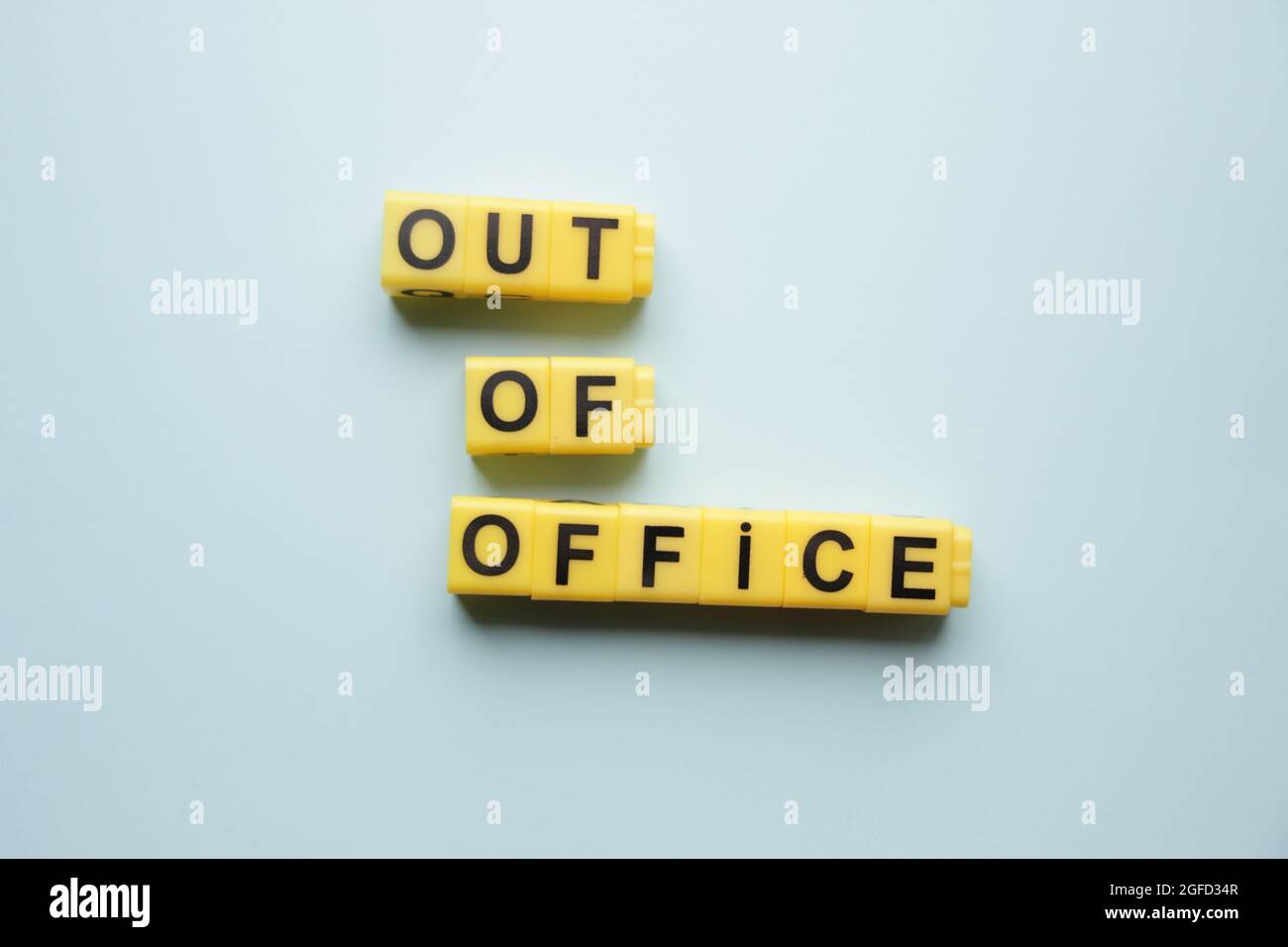 Out of office. Lettering made from yellow cubes Stock Photo - Alamy