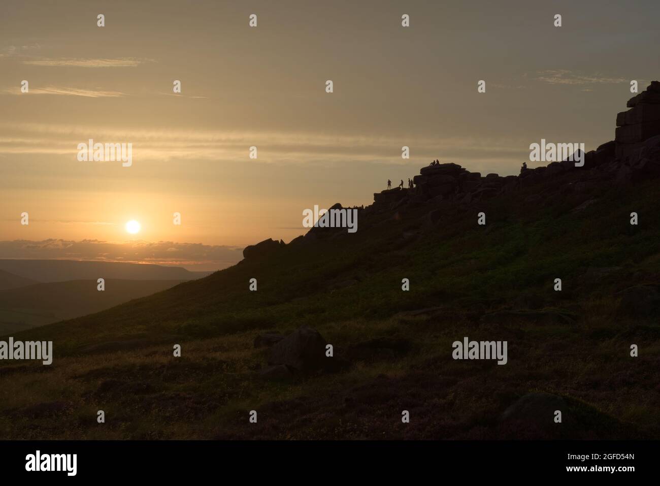 Wide angle sunset at stanage edge. Many people pursue outdoor ...