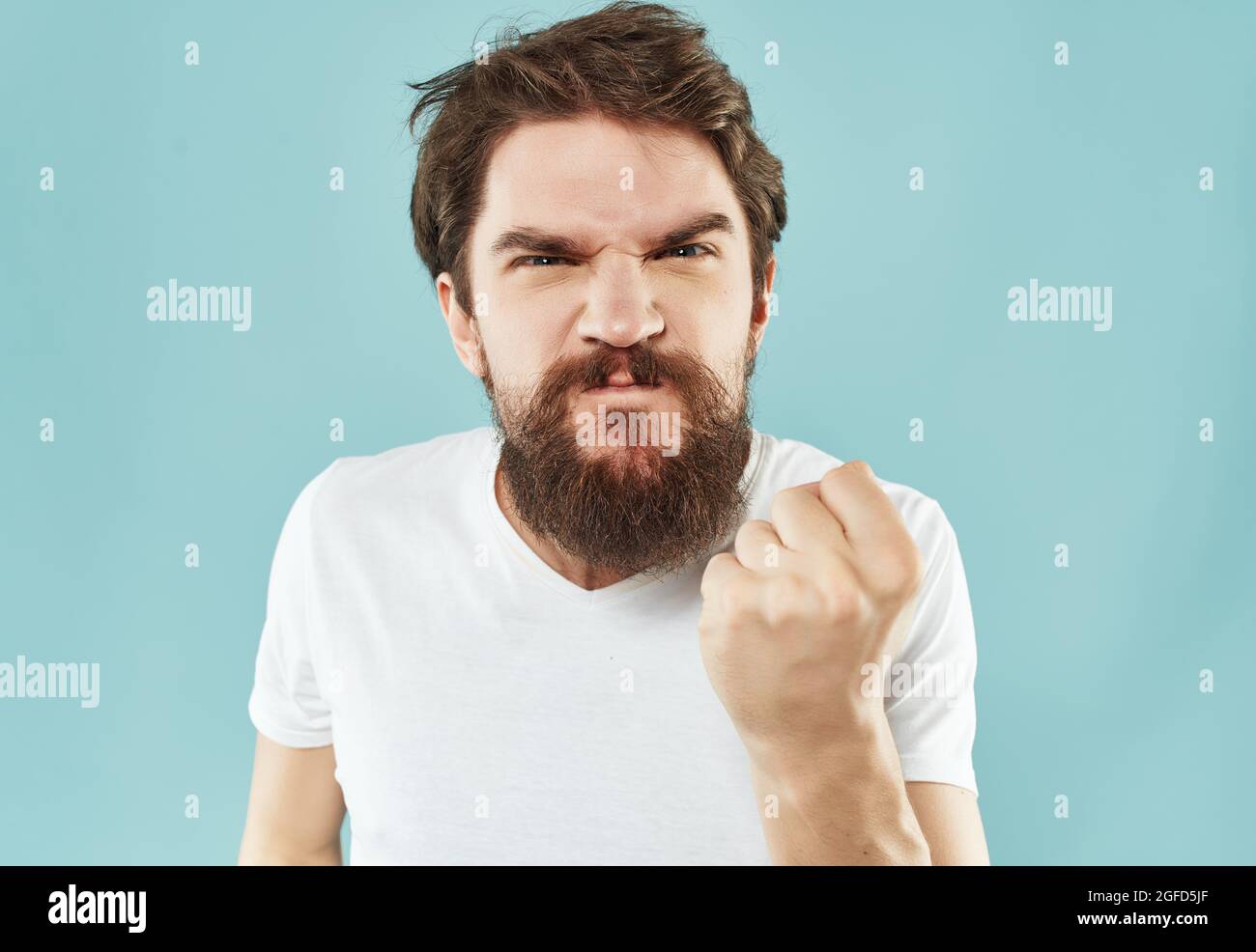 Man in a white t-shirt expressive look discontent Lifestyle Stock Photo ...