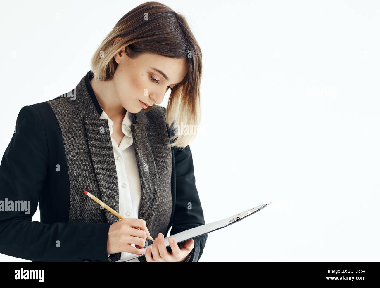 Business woman fills out document manager office work Stock Photo - Alamy