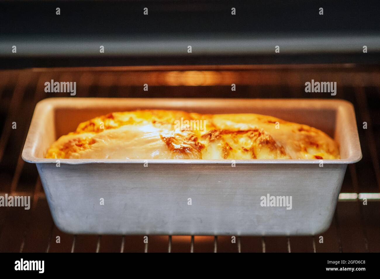 Baking concept. home made souffle in the oven. Illuminated with the ...