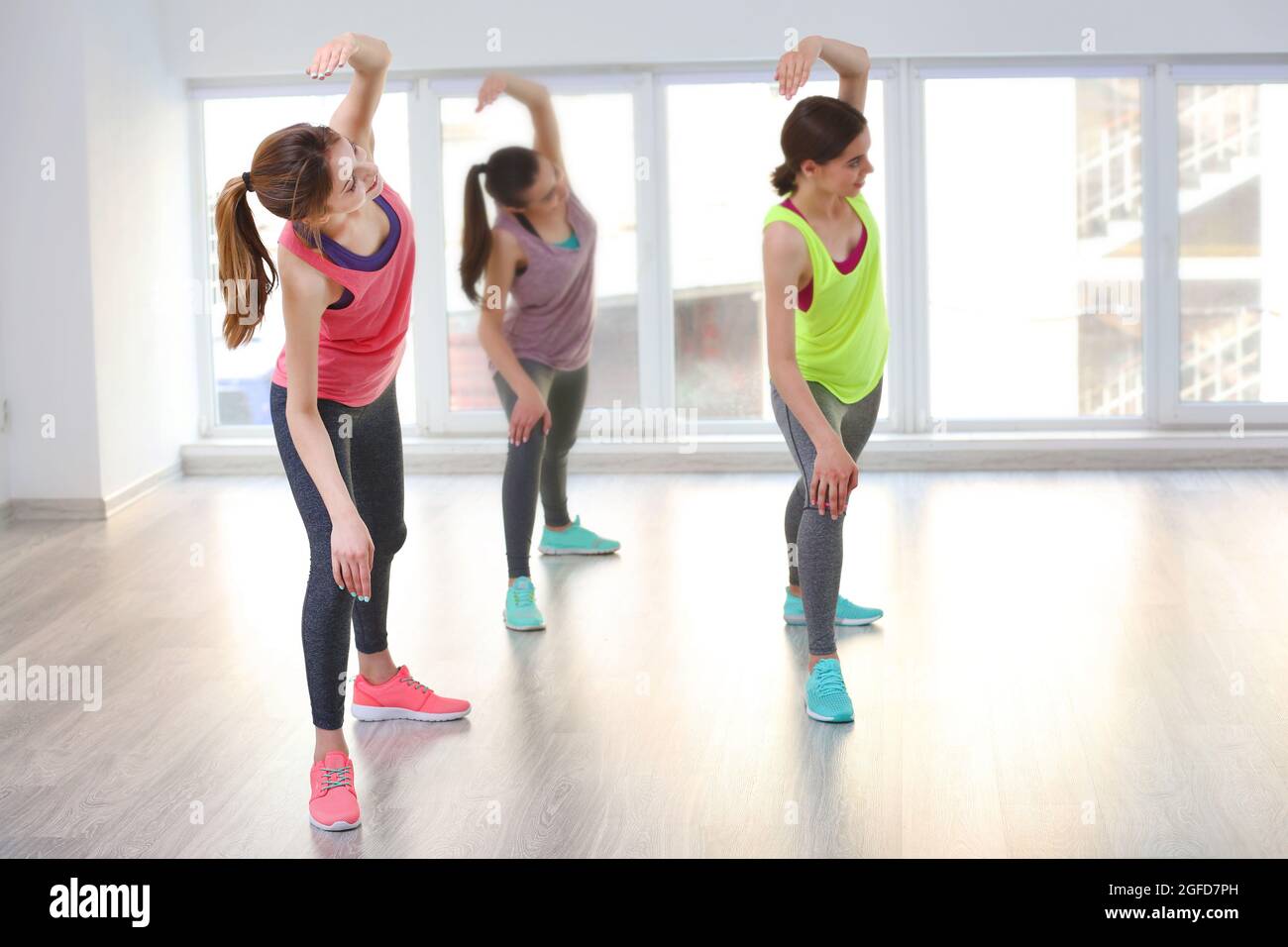 Young women doing exercise in gym Stock Photo - Alamy