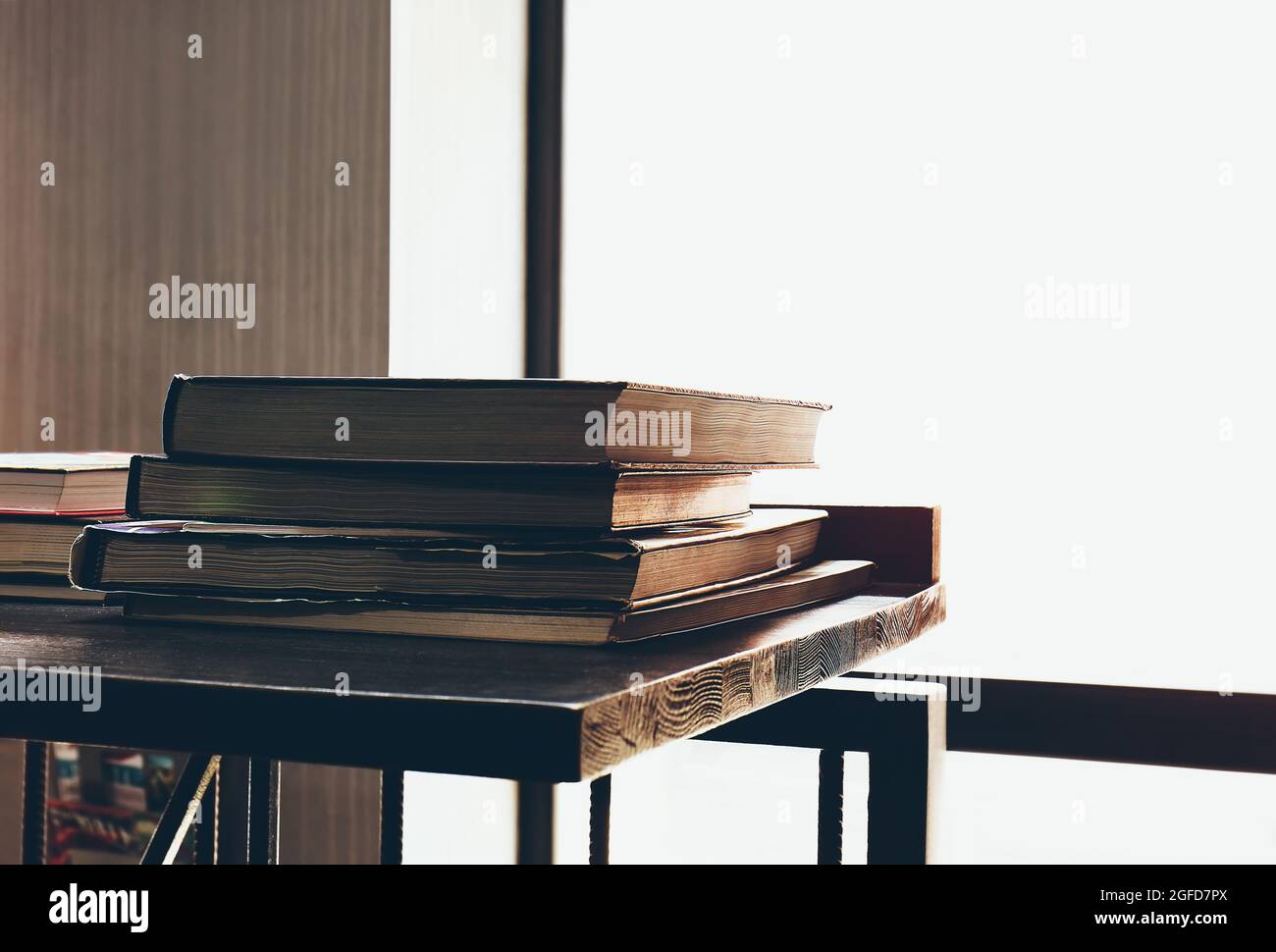 Pile of books on the table Stock Photo - Alamy