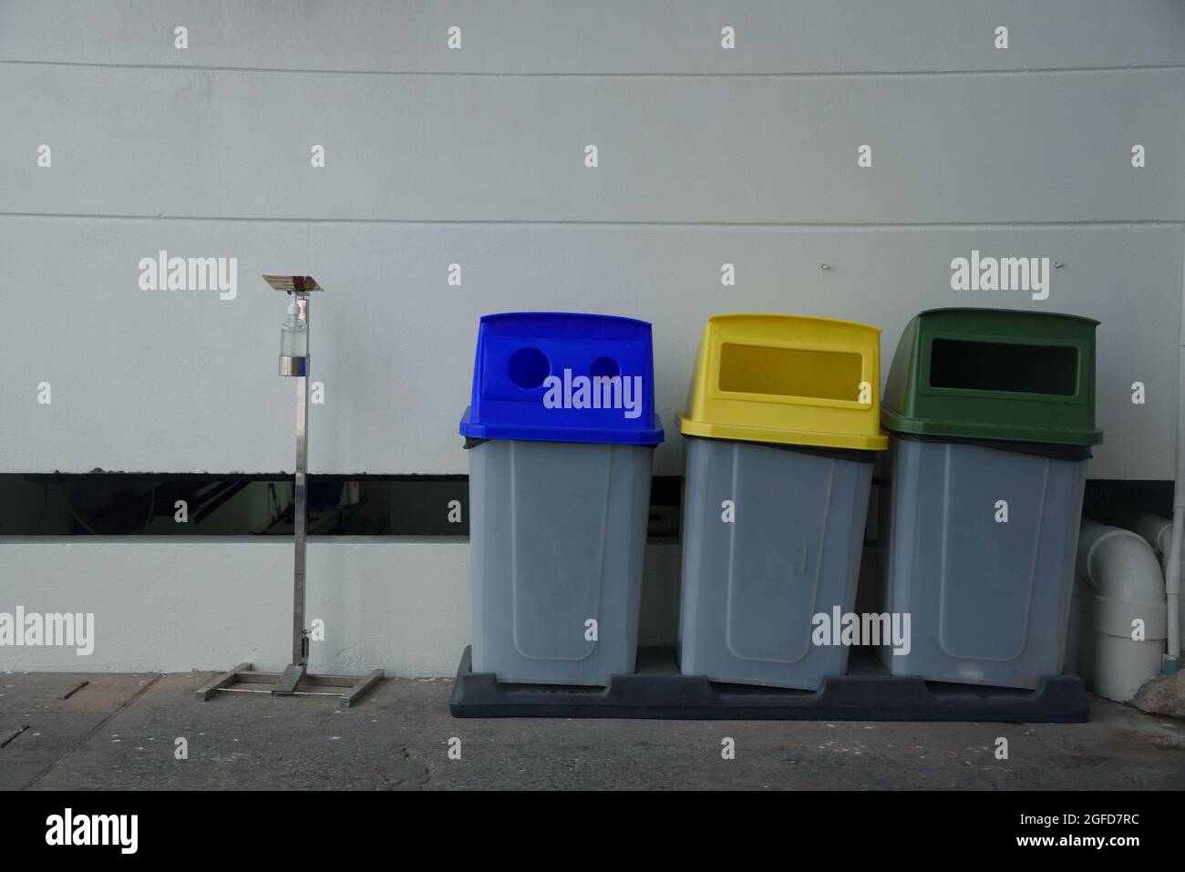Garbage bins separated by colors foe recycling, glass and general waste ...