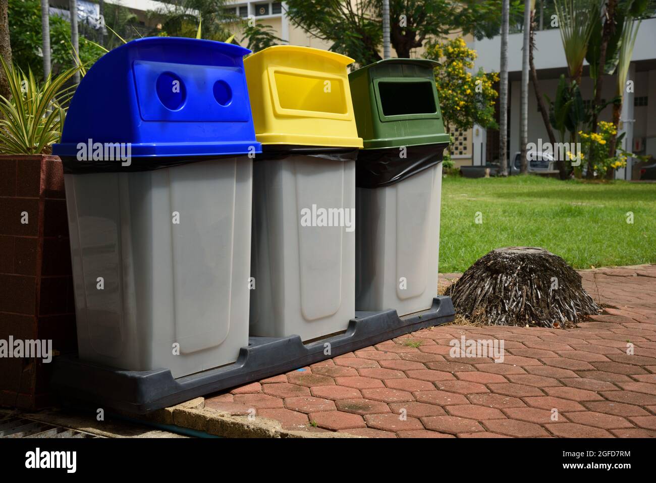 Garbage bins separated by colors foe recycling, glass and general waste ...