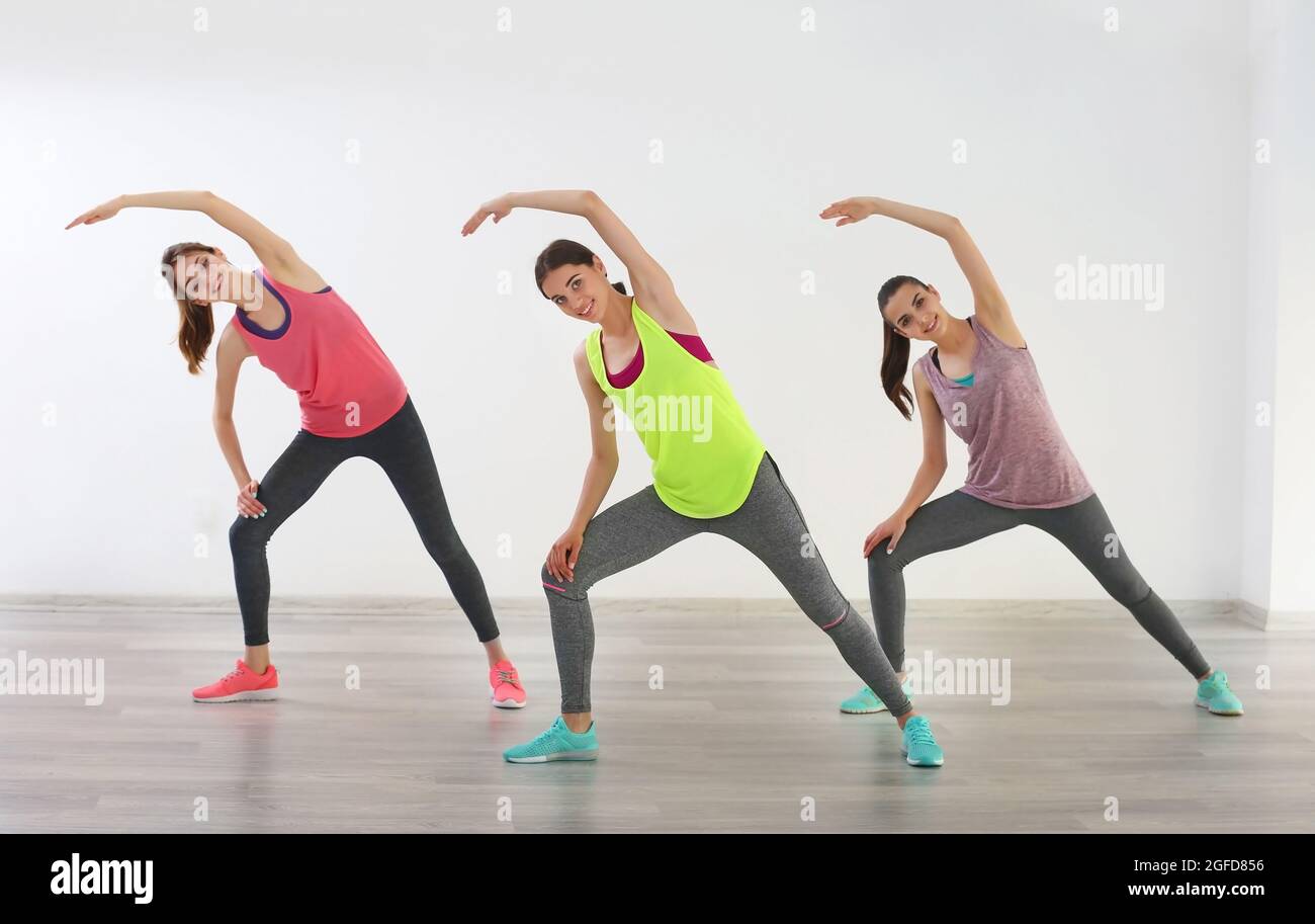 Young women doing exercise in gym Stock Photo - Alamy