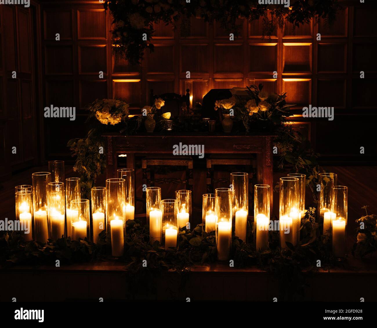 Dark room with lit candles decorating it Stock Photo - Alamy