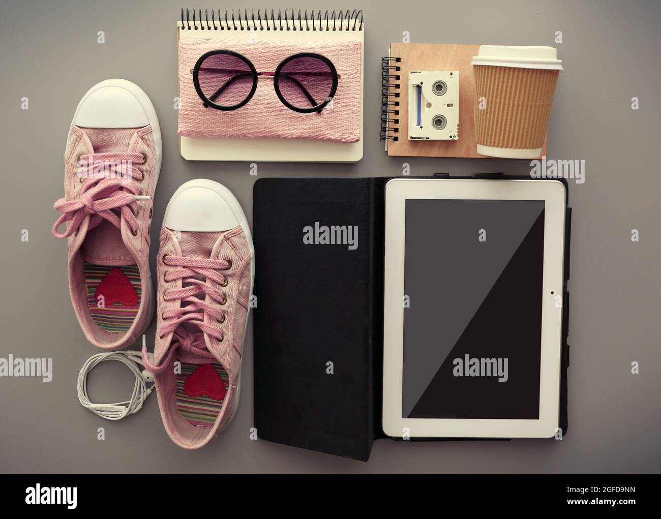 Top view of clothing and personal accessory on the grey background ...