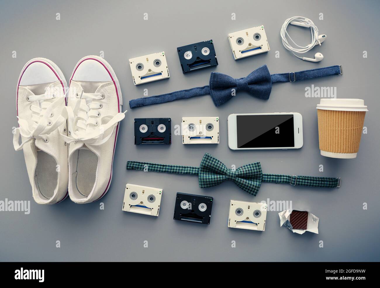 Top view of clothing and personal accessory on the grey background ...