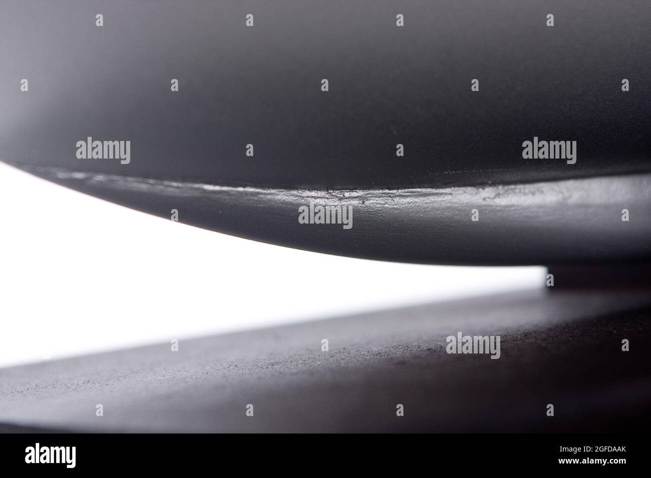 Close up of the surface of a minimalist decorative metal object ...