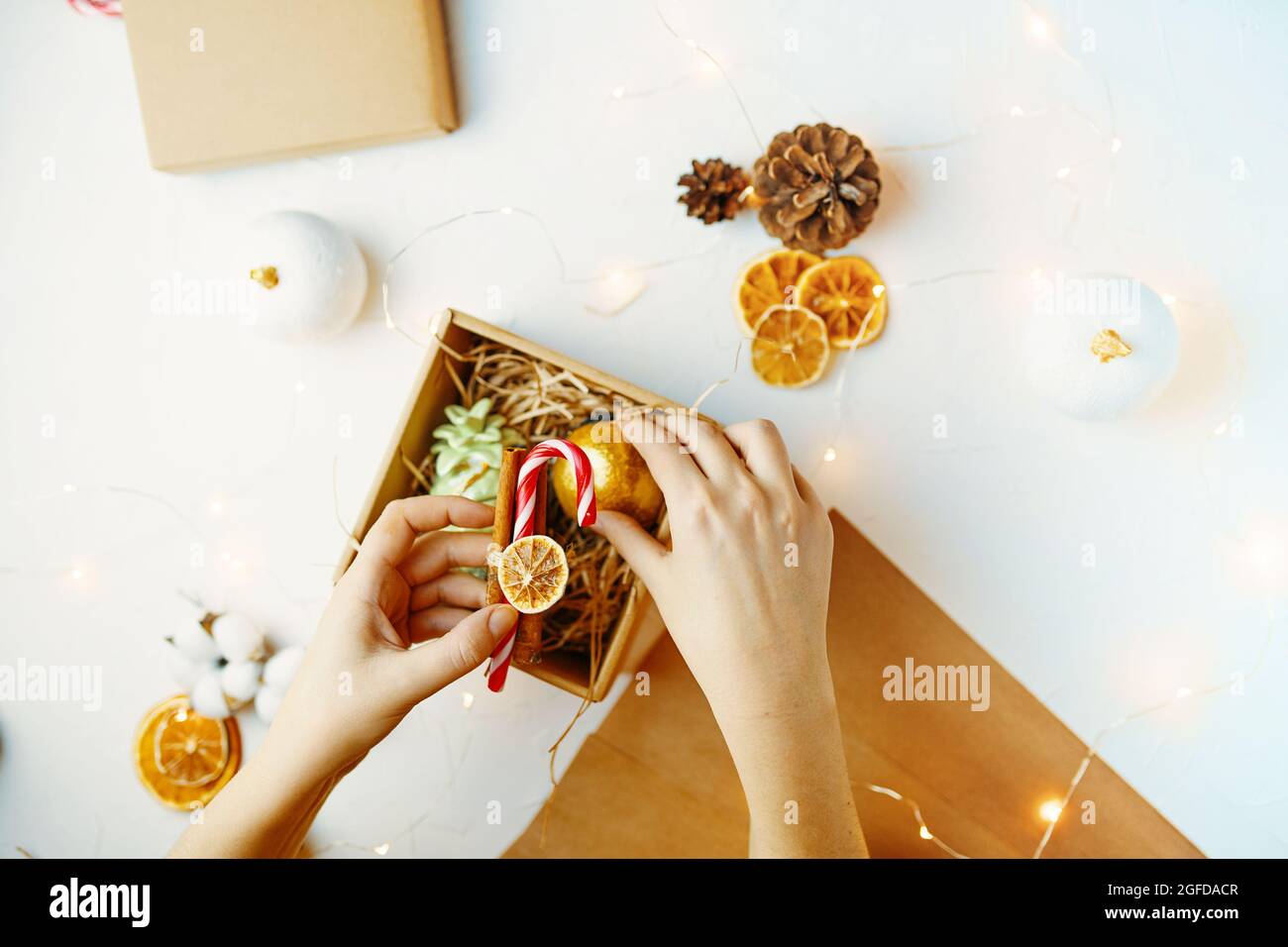 Woman puts candy cane hi-res stock photography and images - Alamy