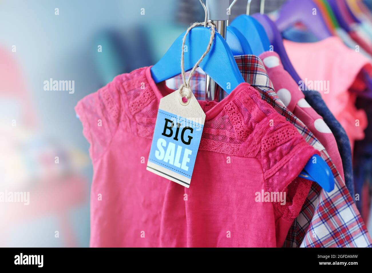 Children clothes hanging on hangers in the shop Stock Photo - Alamy