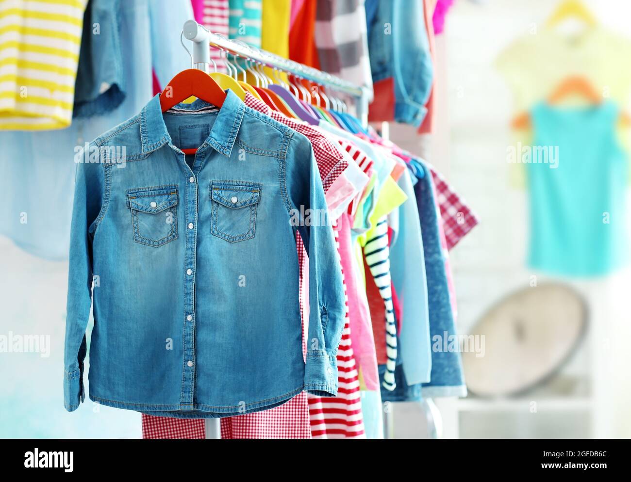 Children clothes hanging on hangers in the shop Stock Photo - Alamy