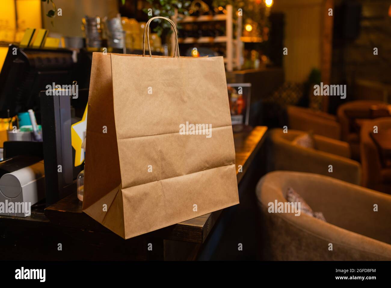 dessert paper bag waiting for customer on counter in modern cafe coffee ...