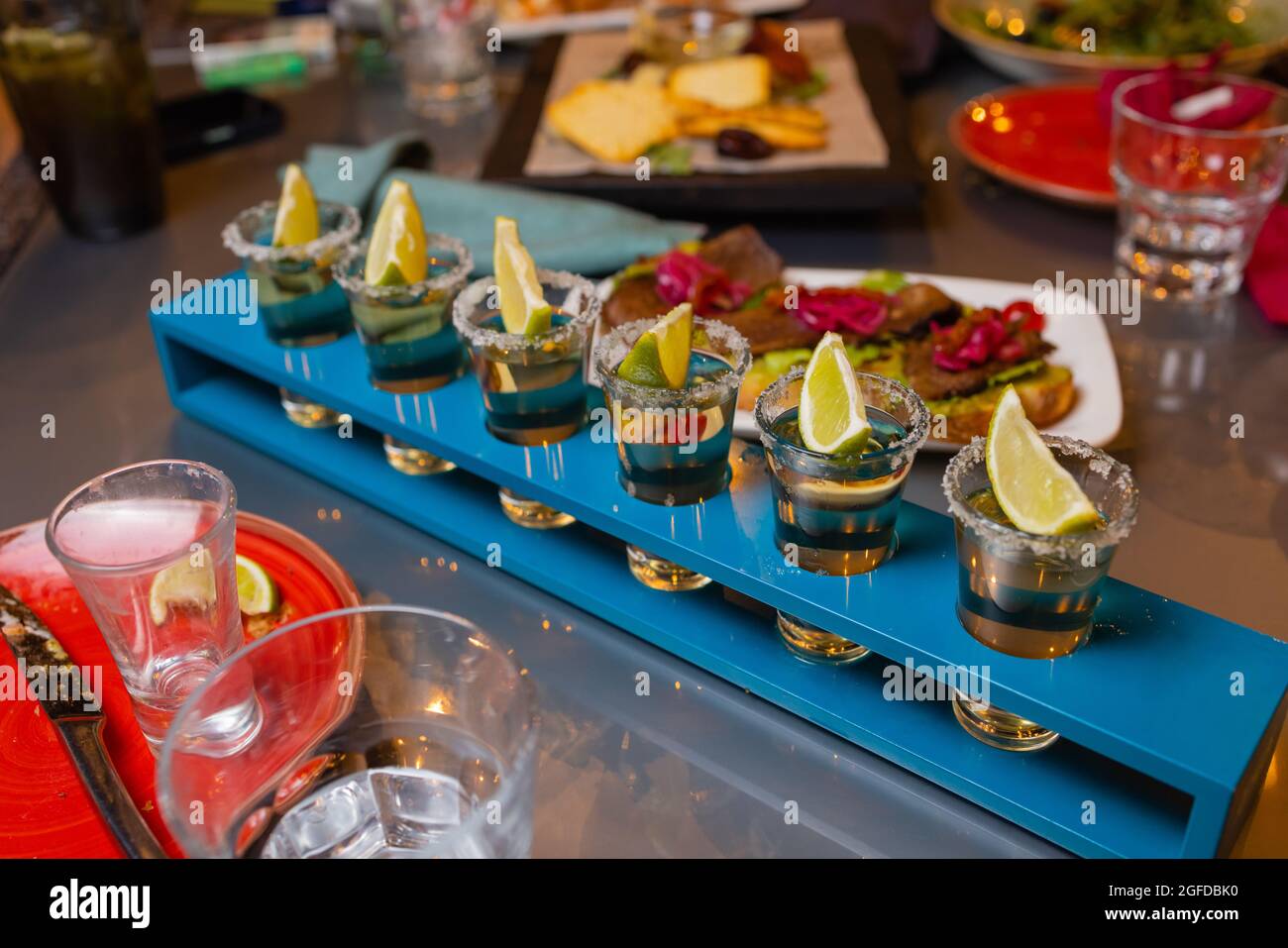 Barman make alcoholic shots with rum and liquor Stock Photo - Alamy