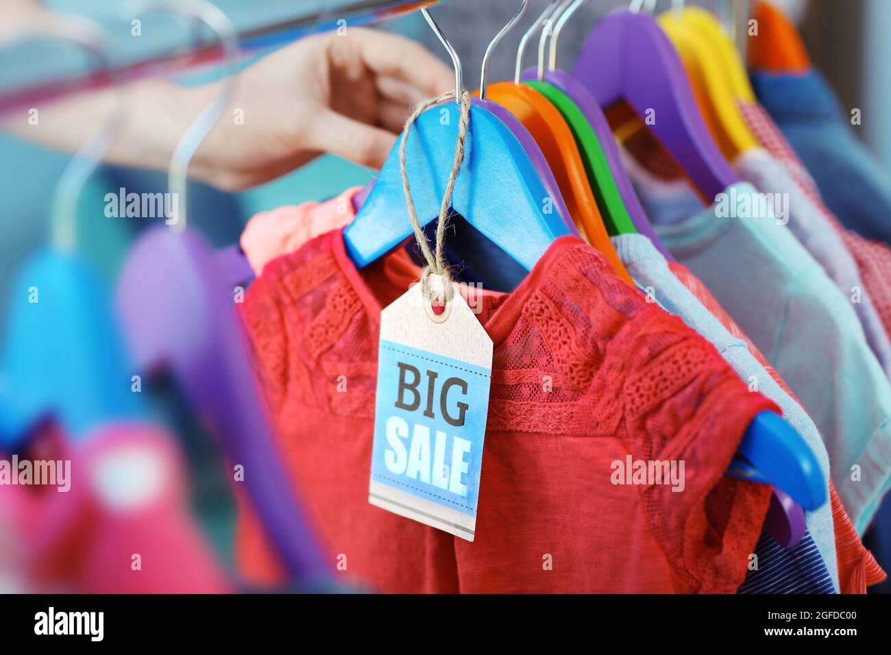 Children clothes hanging on hangers in the shop Stock Photo - Alamy