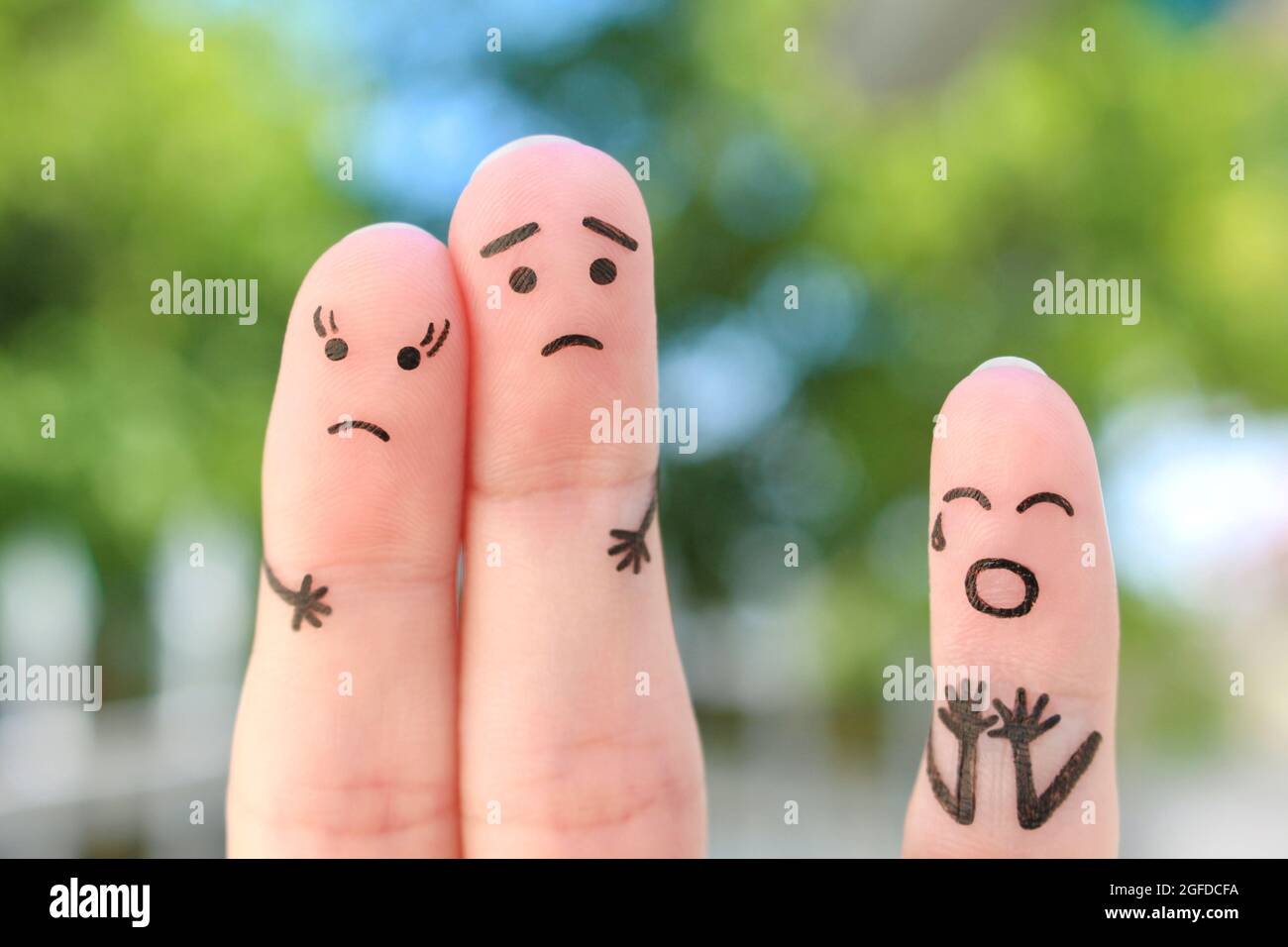 Fingers art of family during quarrel. Concept child is crying, parents ...