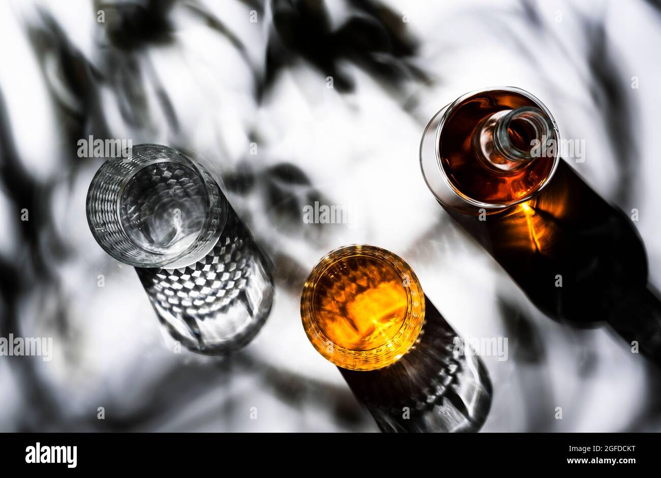 American bourbon whiskey in glasses and bottle, white background with ...