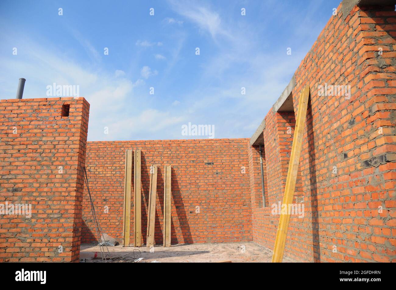 An inside view from an incomplete brick house construction with built ...