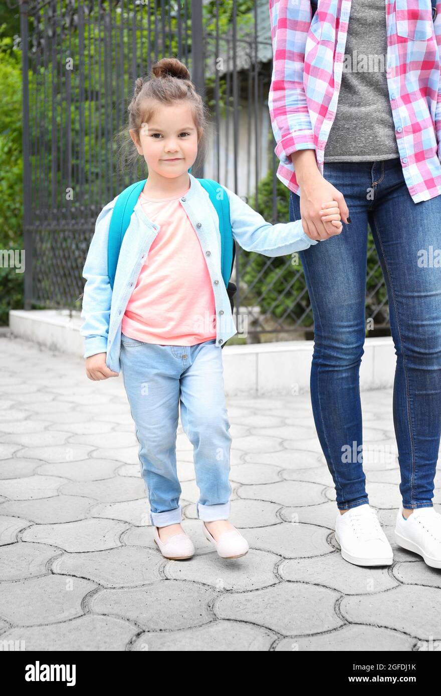 Parent taking child to school Stock Photo - Alamy
