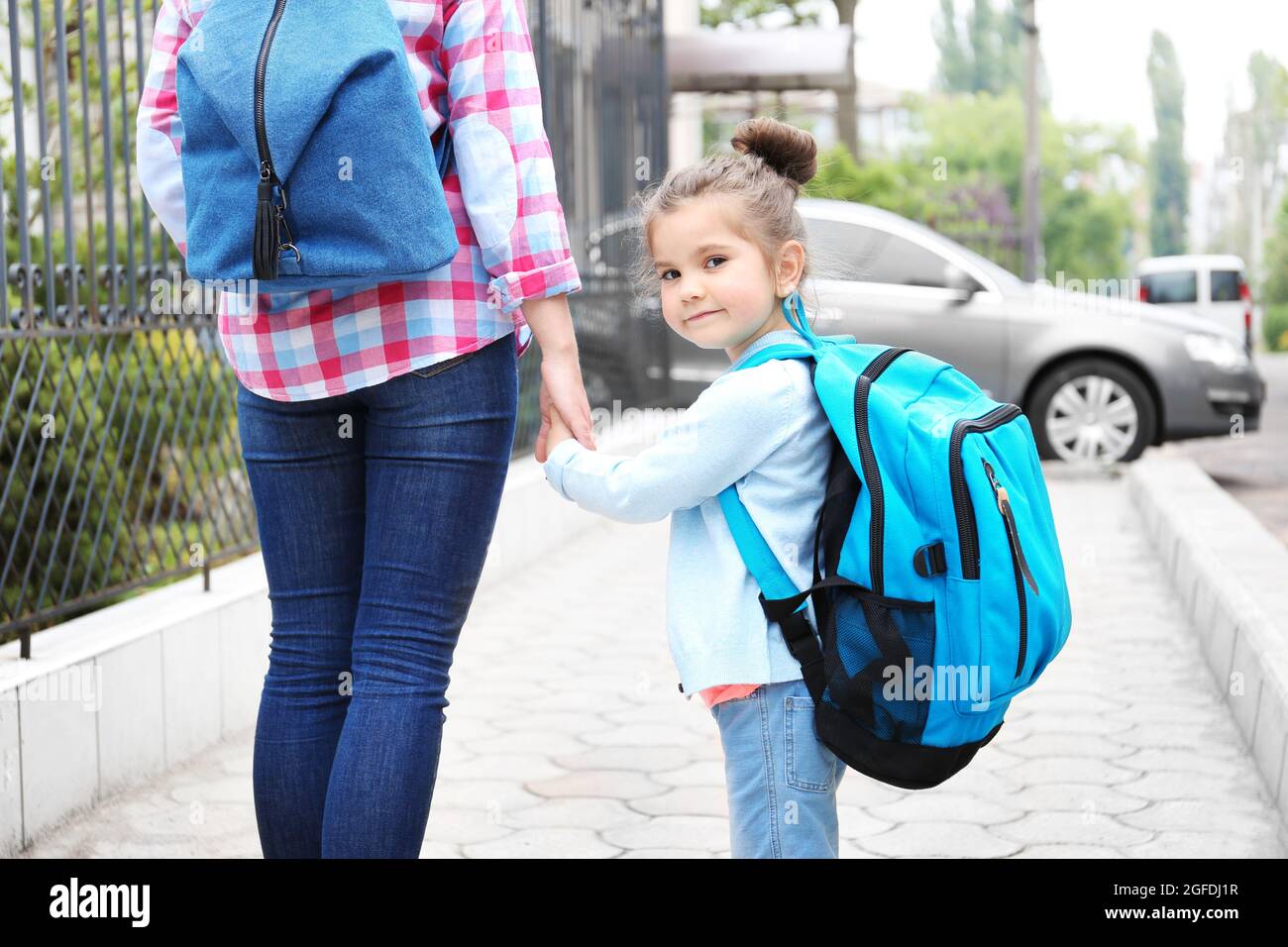 Parent taking child to school Stock Photo - Alamy