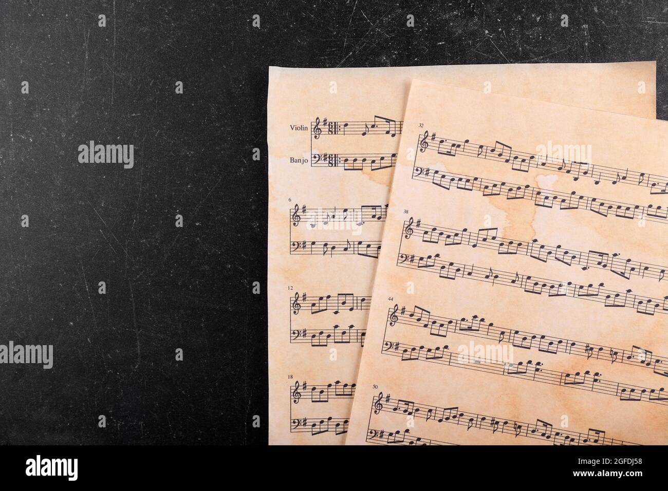 Music notes sheets on grey background Stock Photo - Alamy