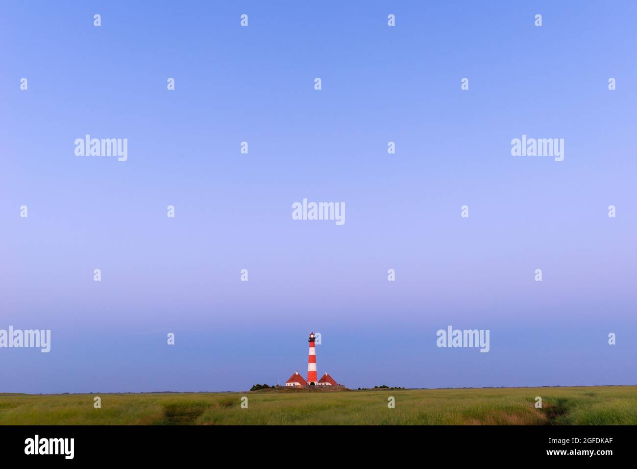 Lighthouse Westerheversand with its two lighthouse keeper houses on the ...