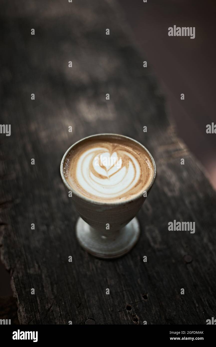 Selective focus cup of hot latte art coffee,focus at white foam Stock ...
