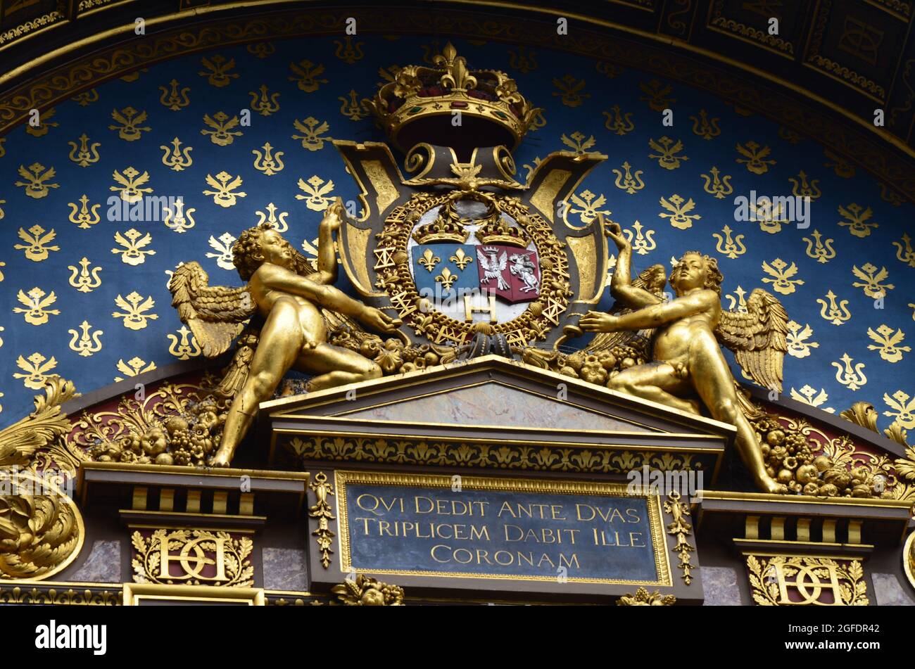 Gilded Conciergerie clock hang on the Clock Tower of the Conciergerie ...
