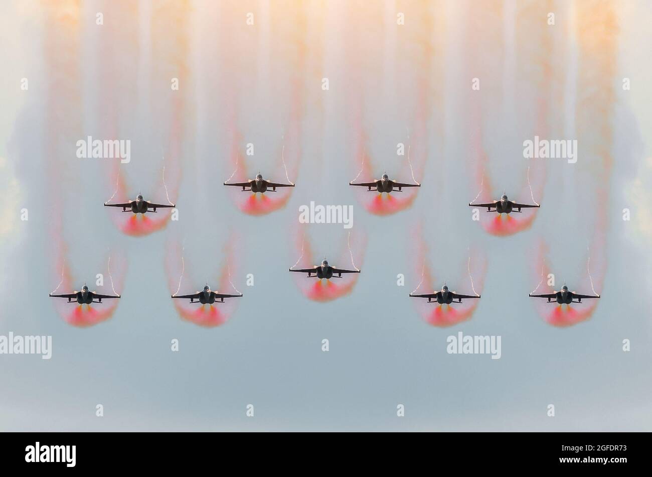 Nine fighter jets fly together with red smoke Stock Photo - Alamy