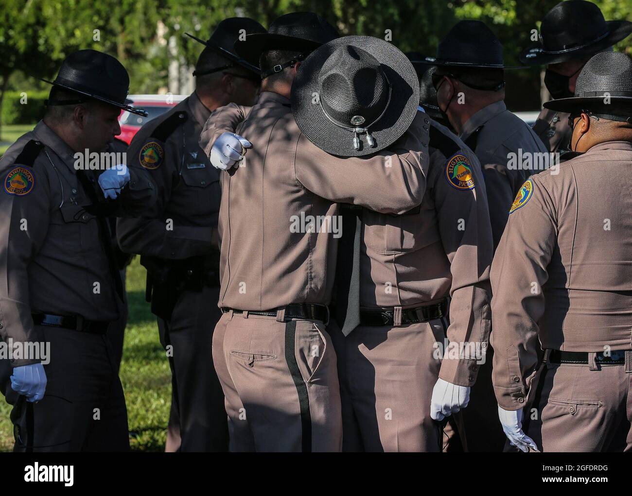 Miami, USA. 20th Aug, 2021. Florida Highway Patrol Troopers console ...