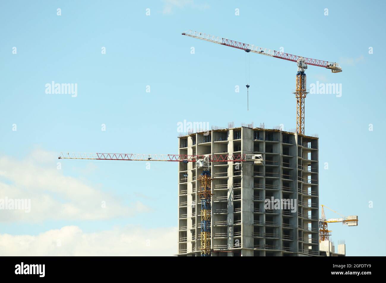 Crane and building construction on sky background Stock Photo - Alamy