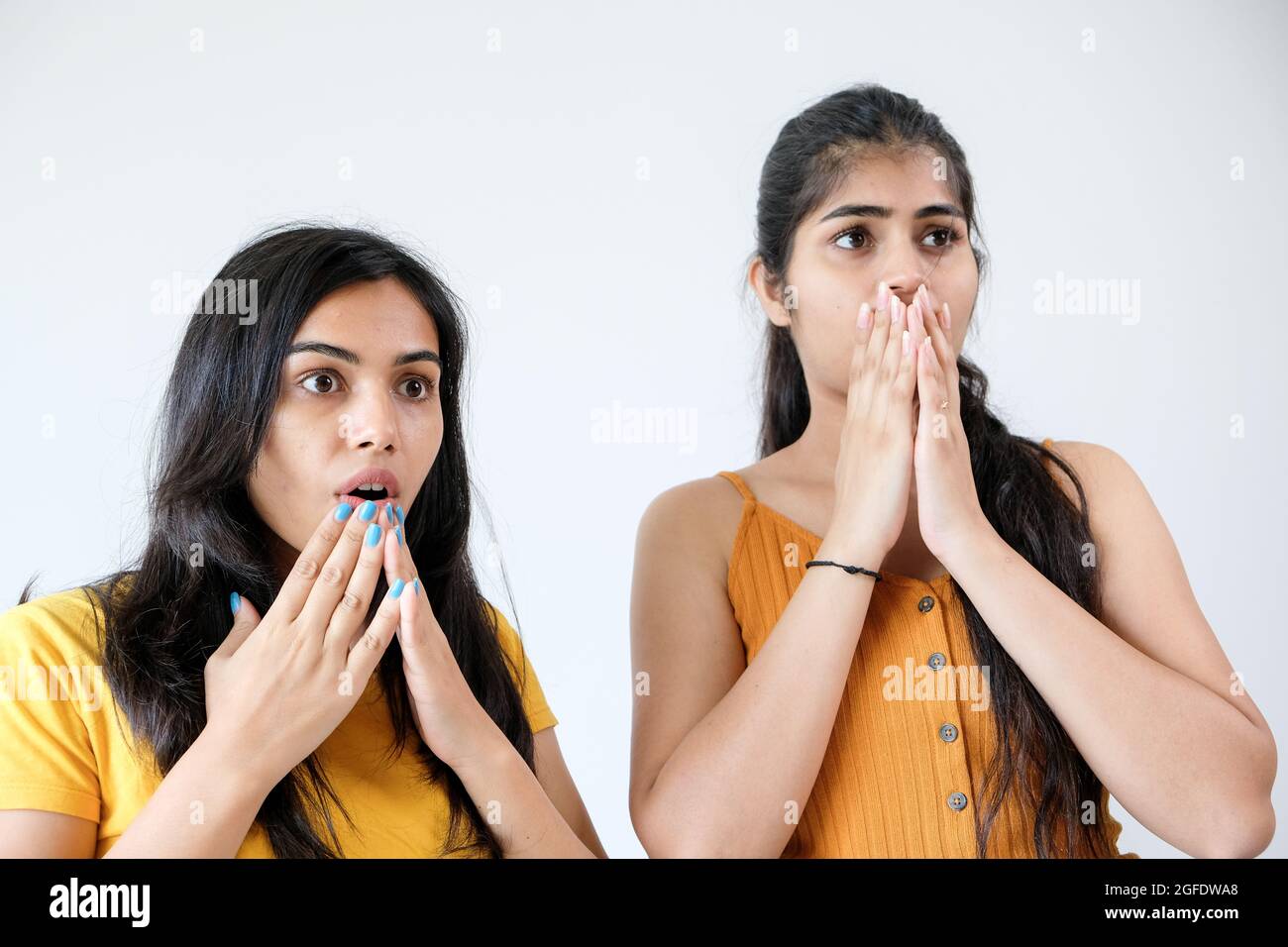 Closeup of two girls surprised by something Stock Photo - Alamy
